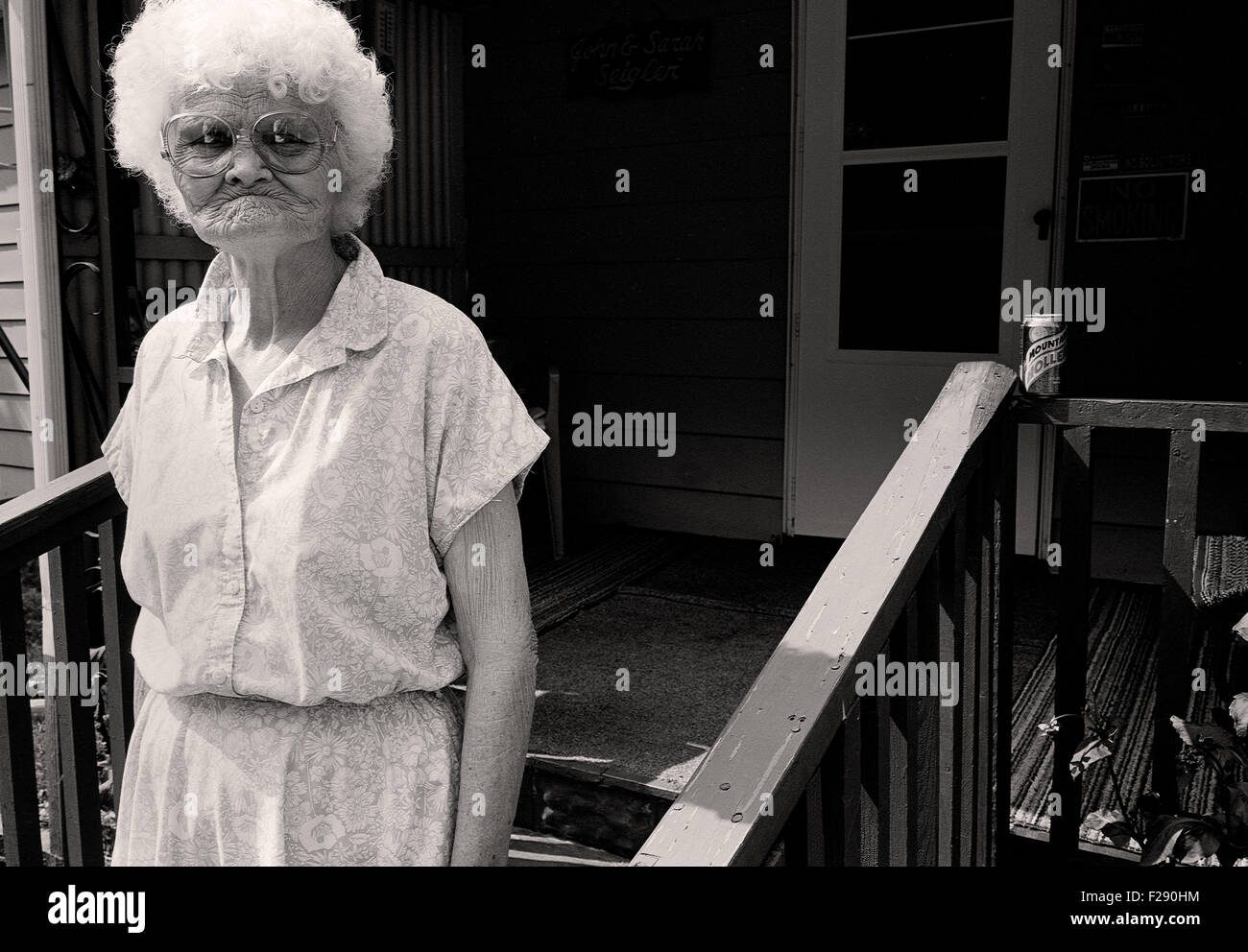 Old lady standing outside shack hi-res stock photography and images - Alamy