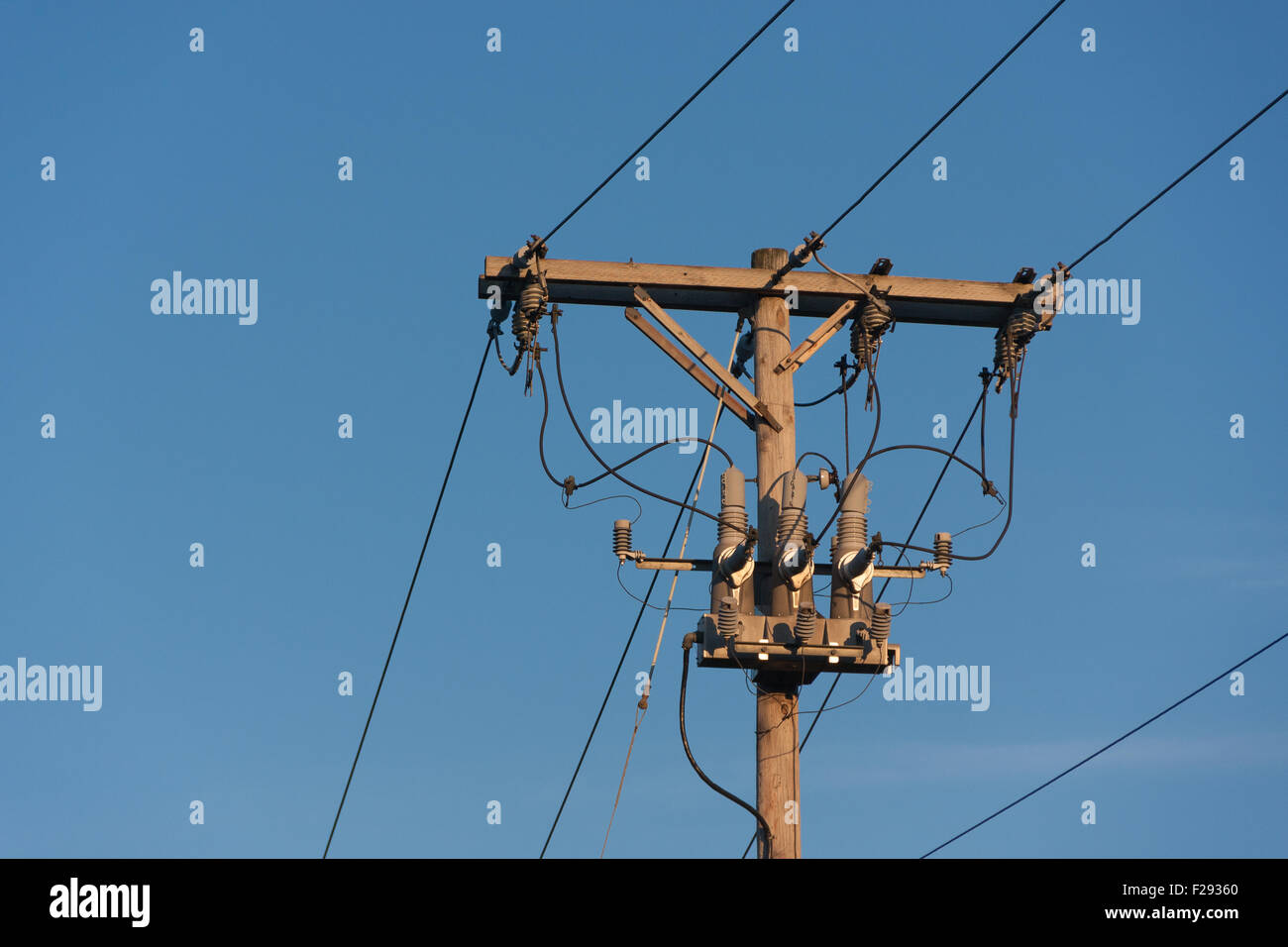 Overhead utility pole with cables and sky Stock Photo - Alamy