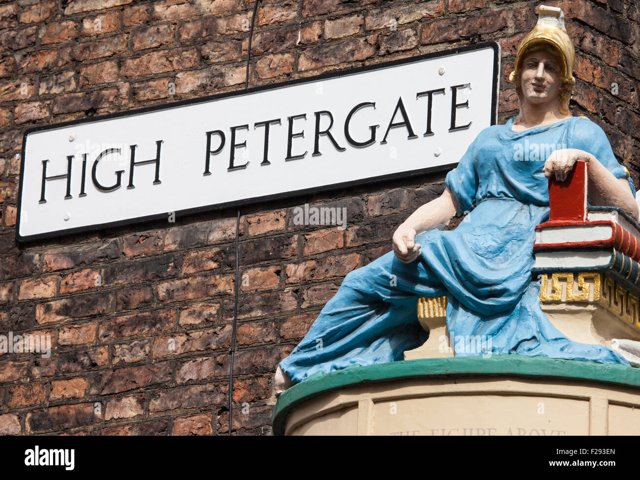 The street sign for High Petergate in York with a statue of Minerva ...