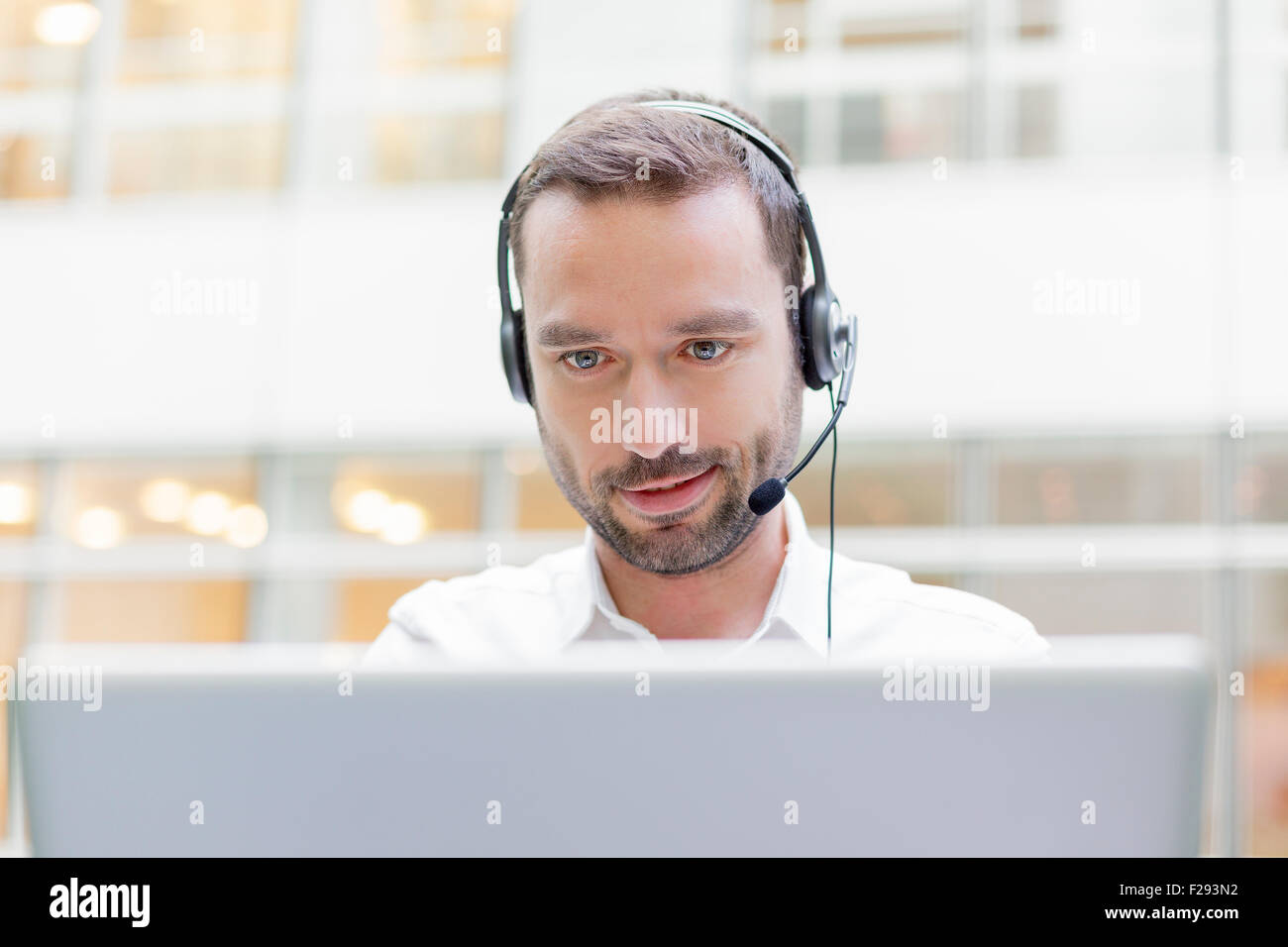 Businessman using headset while working hi-res stock photography and ...