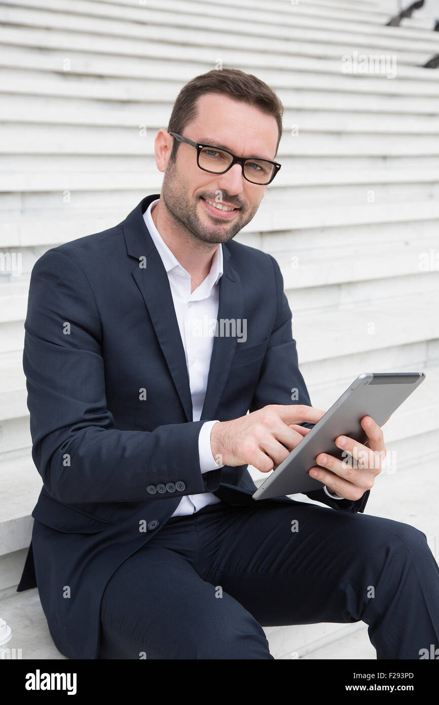 Businessman using a digital tablet Stock Photo - Alamy