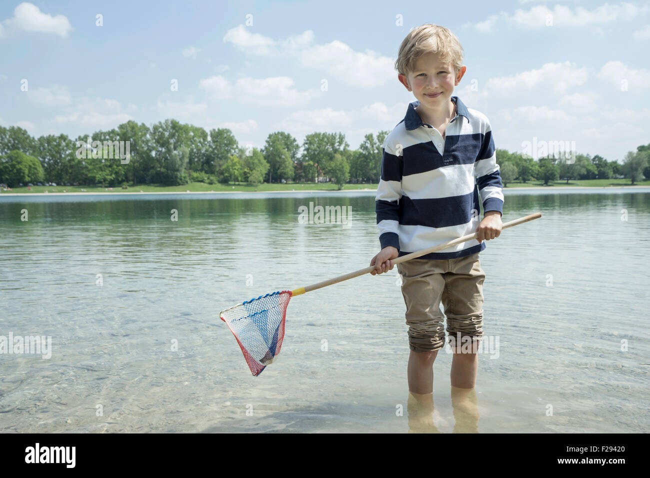 Boy with fishing net hi-res stock photography and images - Alamy