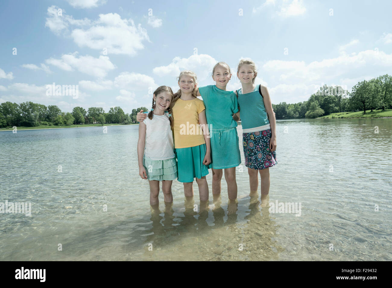 Group of friends standing in the lake, Bavaria, Germany Stock Photo - Alamy