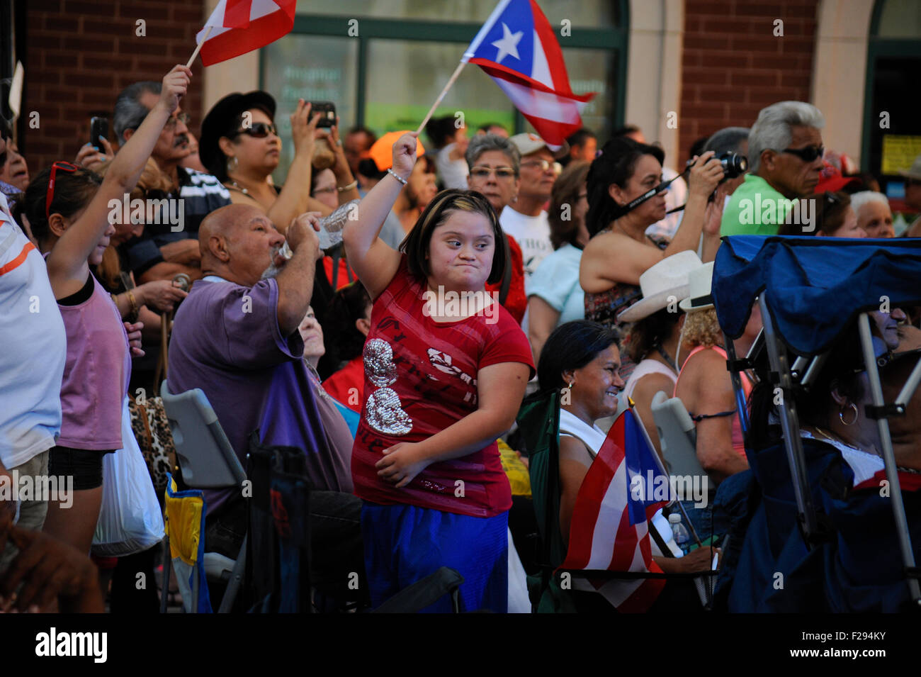 Puerto Ricans waving flags at the Fiesta Boricua (Puerto Rican festival ...