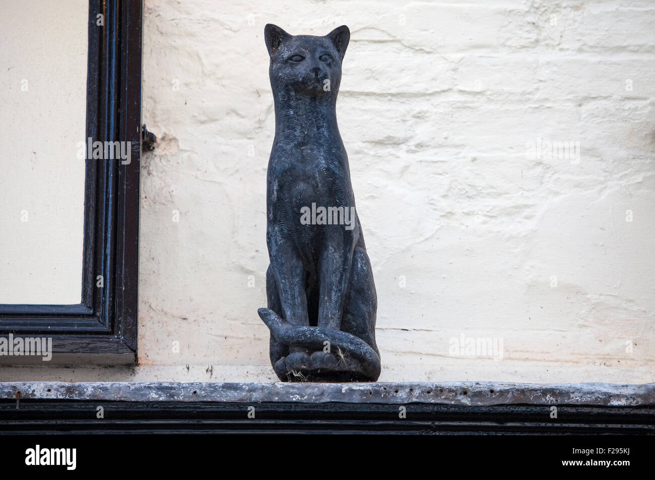 One of the decorative cat statues that are placed on numerous buildings ...