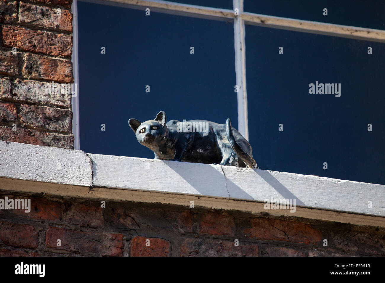 One of the decorative cat statues that are placed on numerous buildings ...