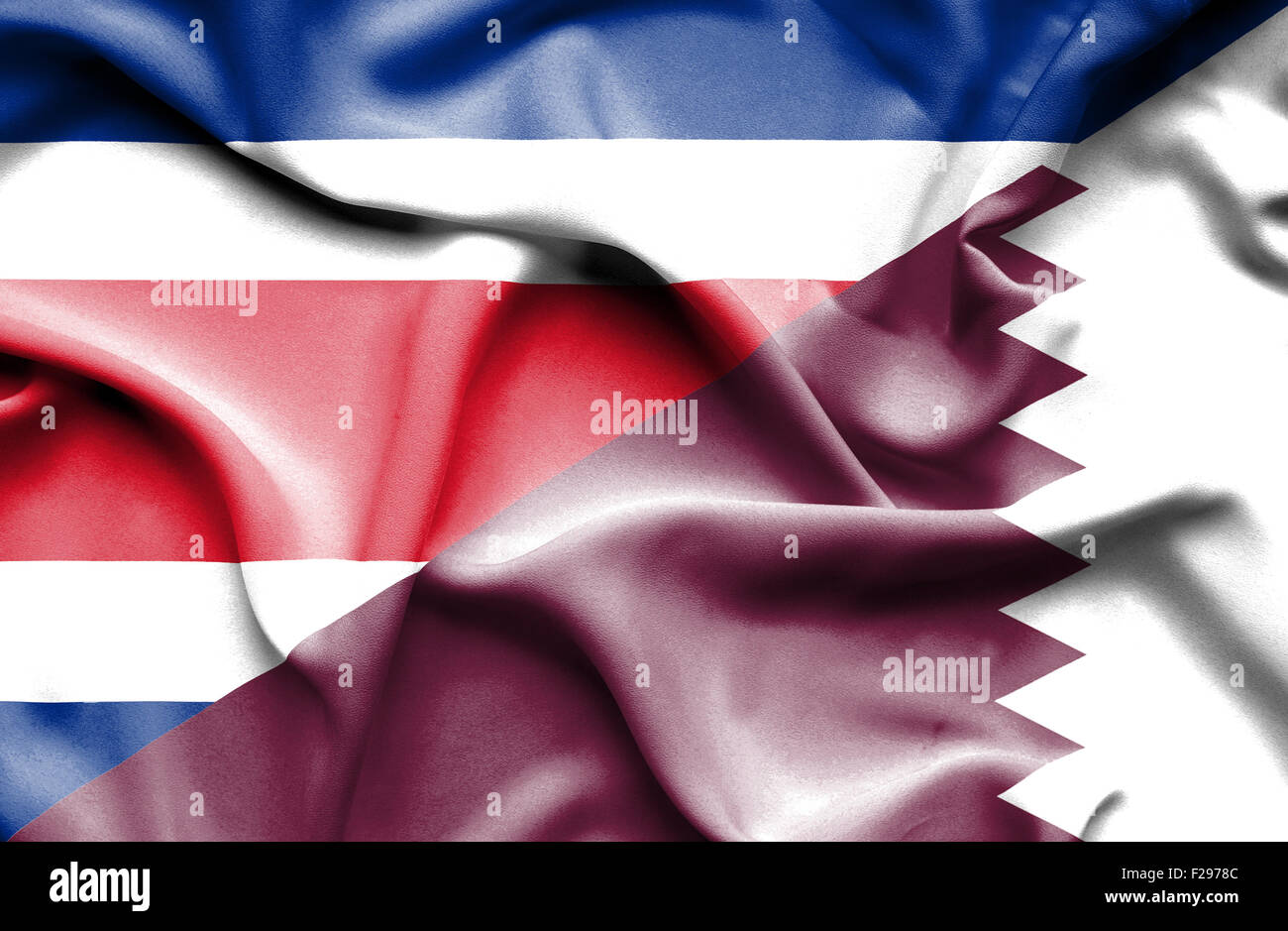 Waving flag of Qatar and Costa Rica Stock Photo - Alamy