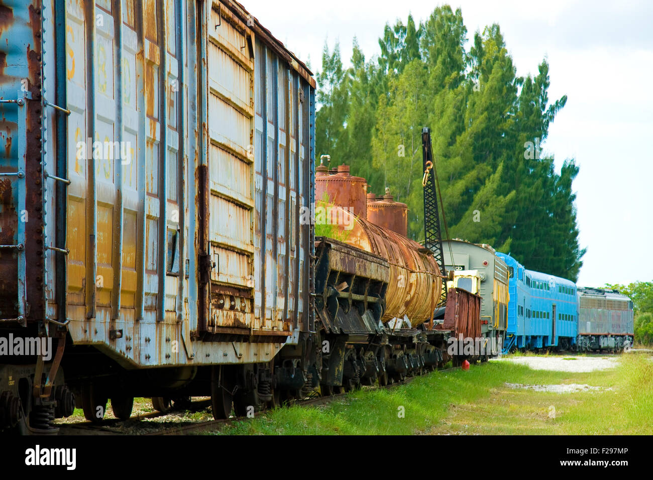 An old cargo train and railroad wagons show signs of aging and decay ...