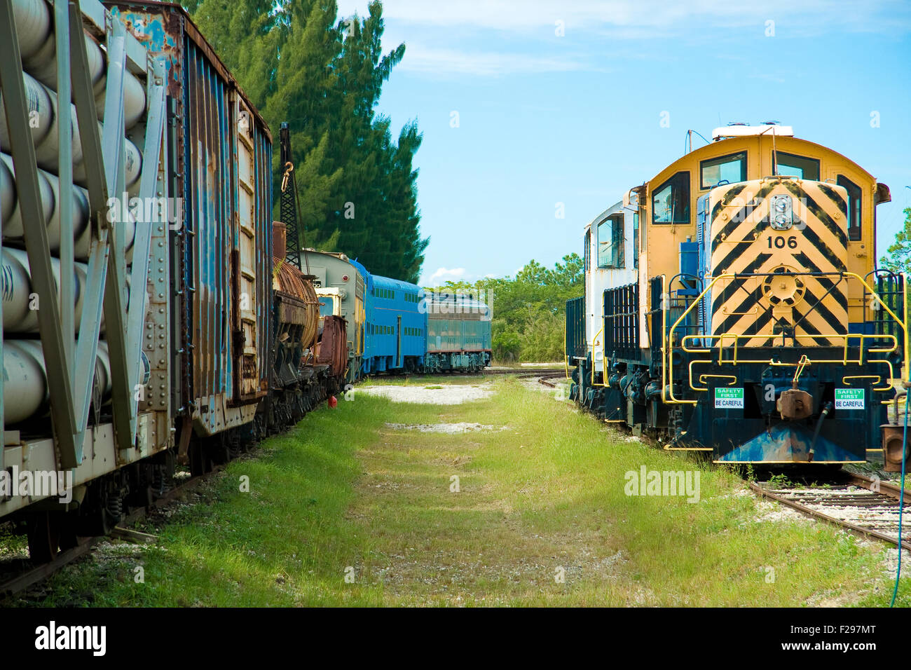 An old train in a train yard, showing signs of aging and decay but is ...