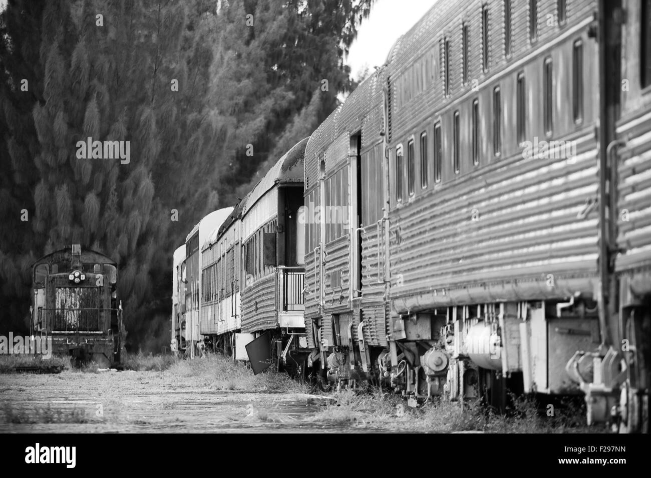 An old train and a locomotive on a trainyard Stock Photo - Alamy