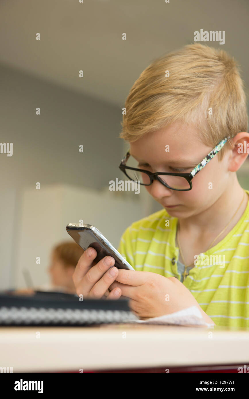 Mobile phone school classroom desk hi-res stock photography and images ...