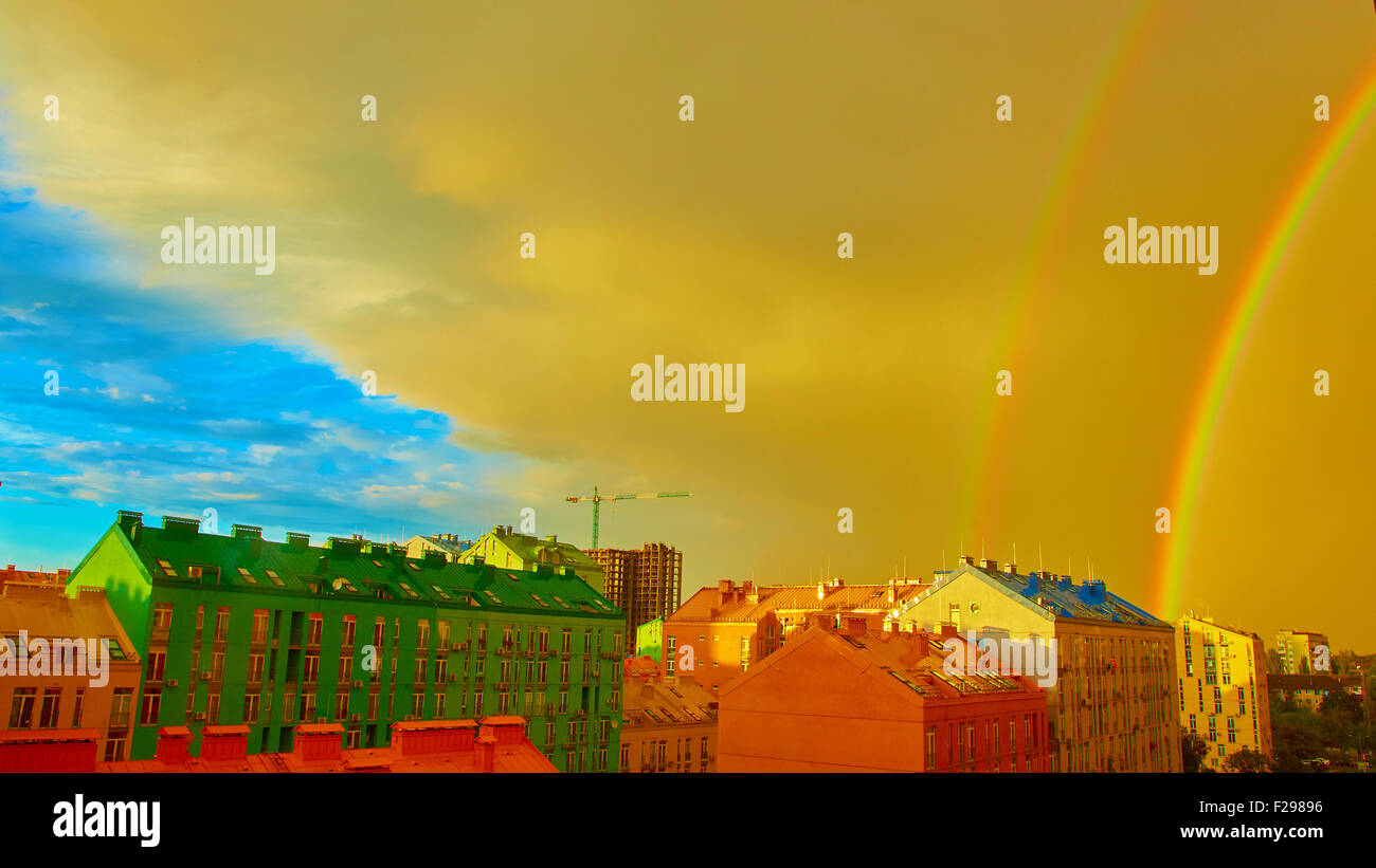 Double rainbow over the city Stock Photo - Alamy