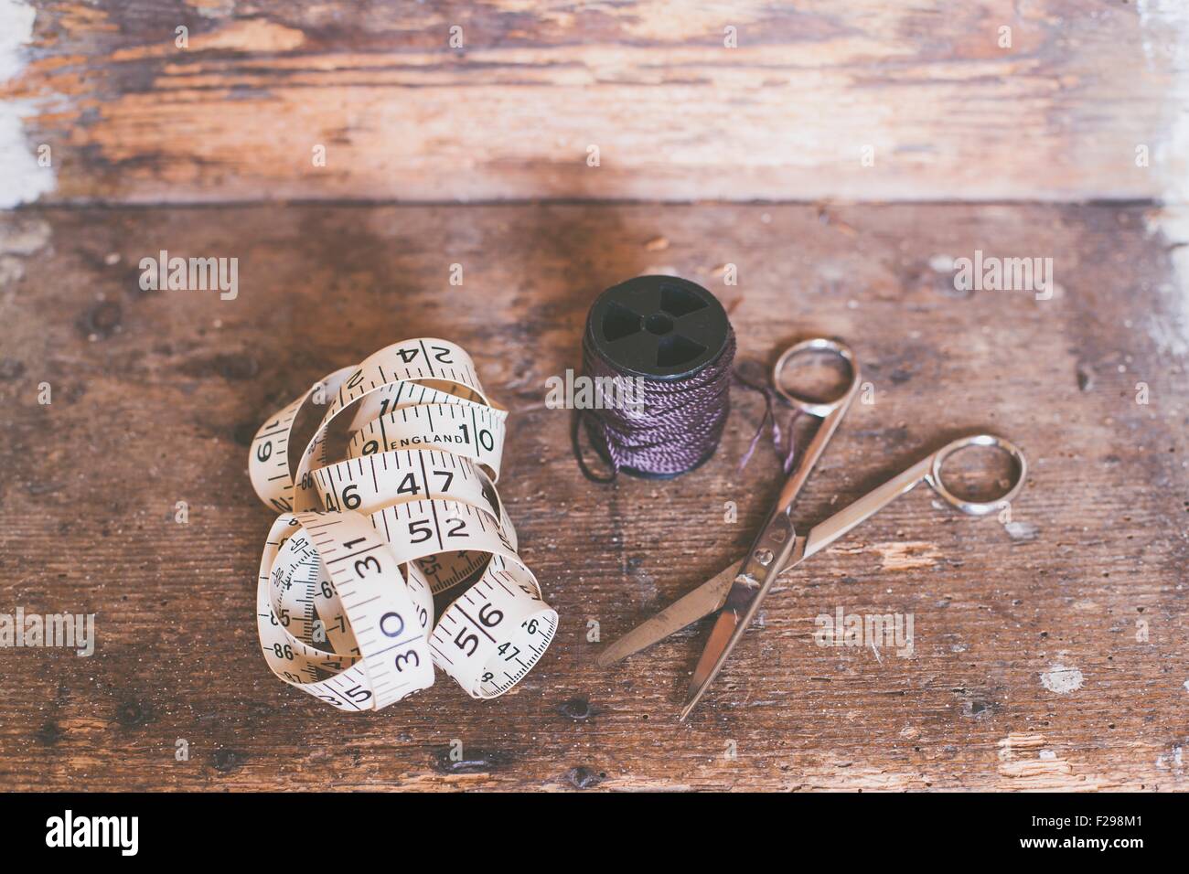 Still life of measureing tape, scissors and sewing thread Stock Photo ...