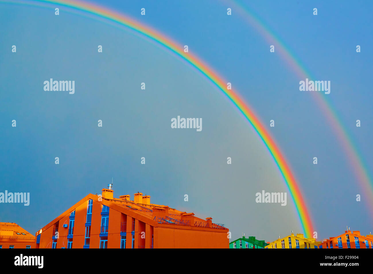 Double rainbow over the city Stock Photo - Alamy