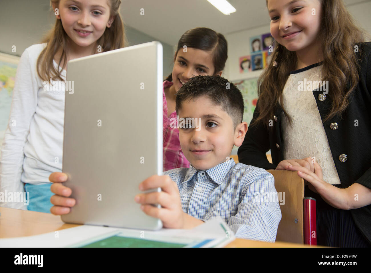 School children using a digital tablet in classroom, Munich, Bavaria ...