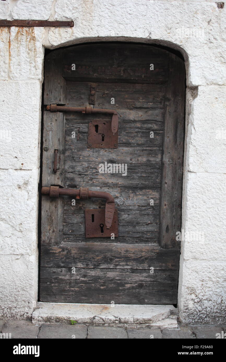 Old wooden door with rusty bolt Stock Photo - Alamy