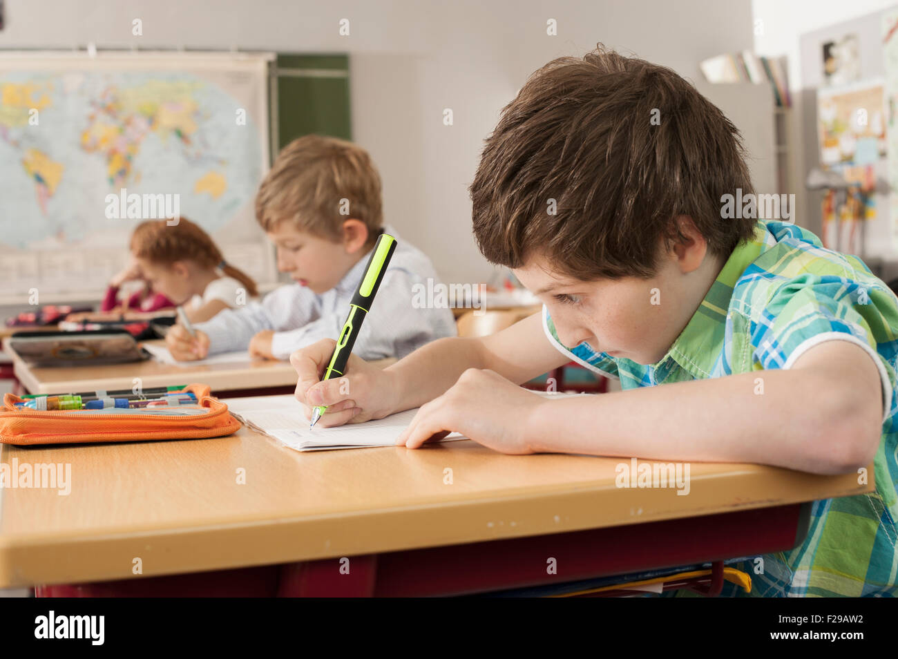 school students writing in notebooks, Munich, Bavaria, Germany Stock ...