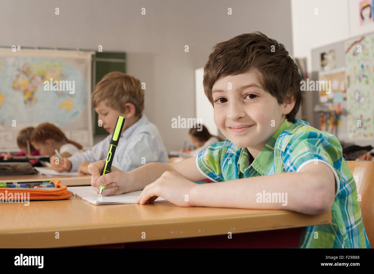 school students writing in notebooks, Munich, Bavaria, Germany Stock ...