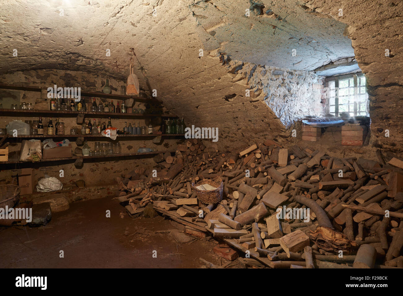 Old, dark basement with wood pile in ancient house Stock Photo - Alamy
