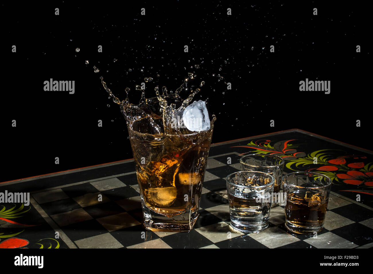 Russian Alcohol checkers with splashes of whiskey. Low-Key Stock Photo ...