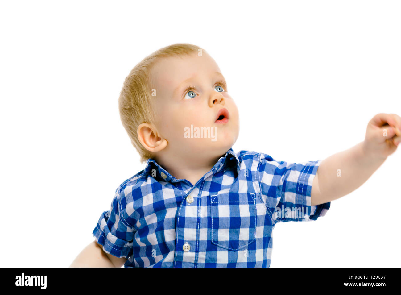 baby boy looking up on a white background Stock Photo - Alamy