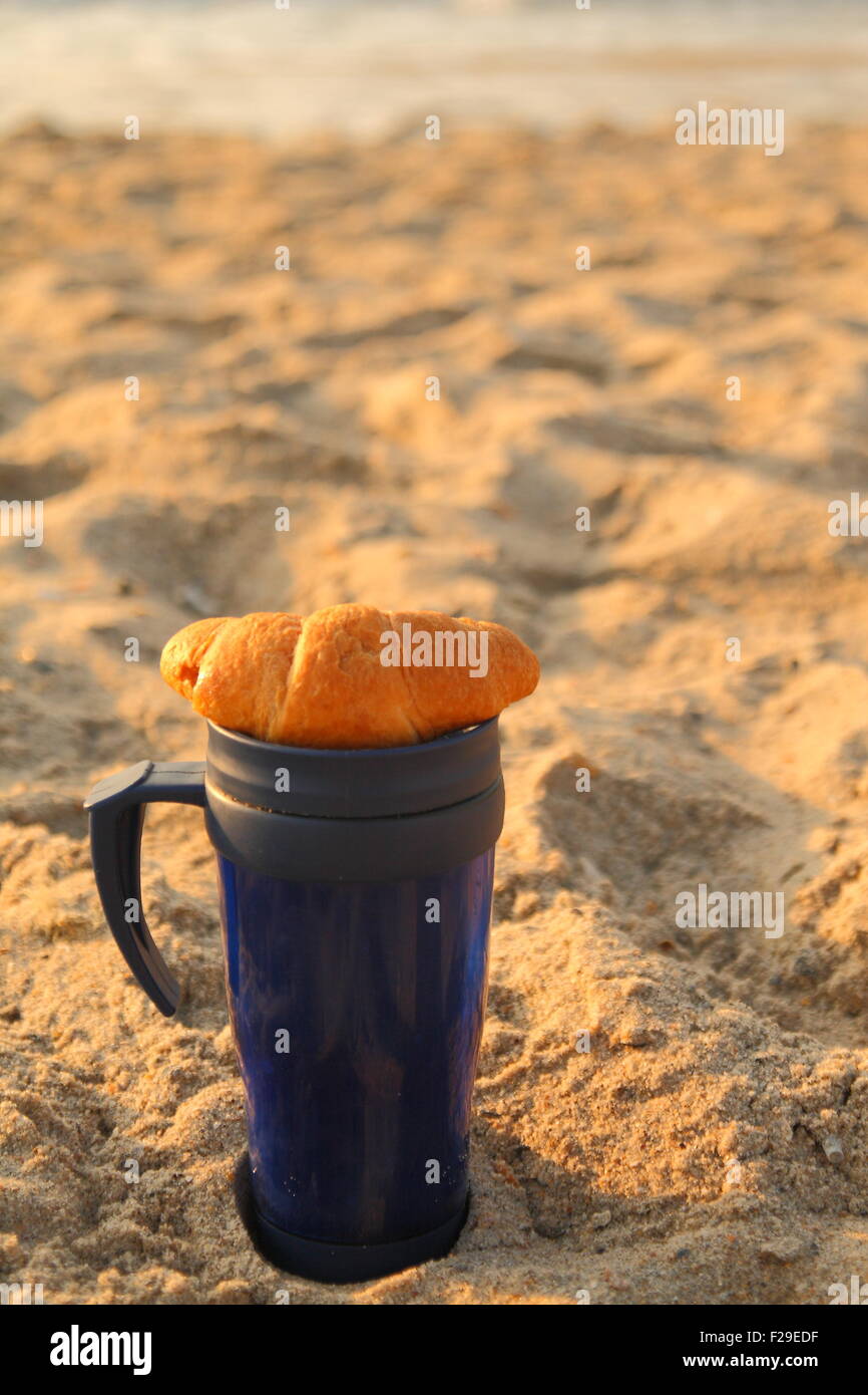 Coffee and croissant on the beach Stock Photo - Alamy