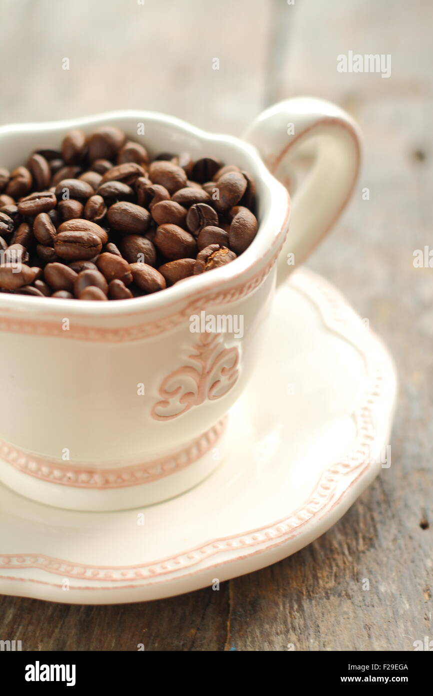 Coffee beans in a cup Stock Photo - Alamy