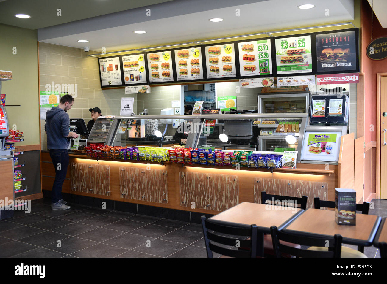 A customer being served in Subway. Picture: Scott Bairstow/Alamy Stock ...