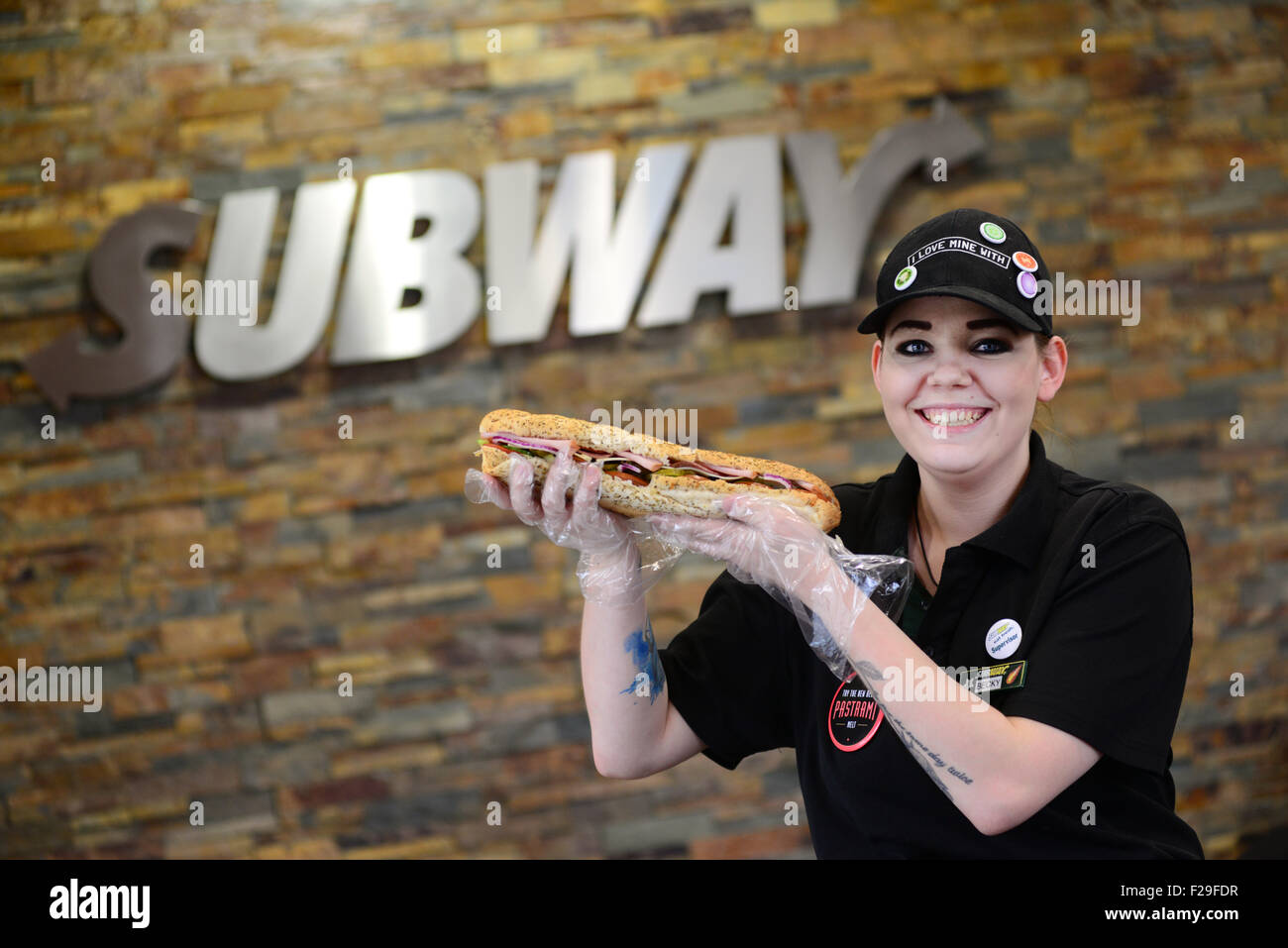 A Subway staff member holding a footlong sandwich. Picture: Scott ...