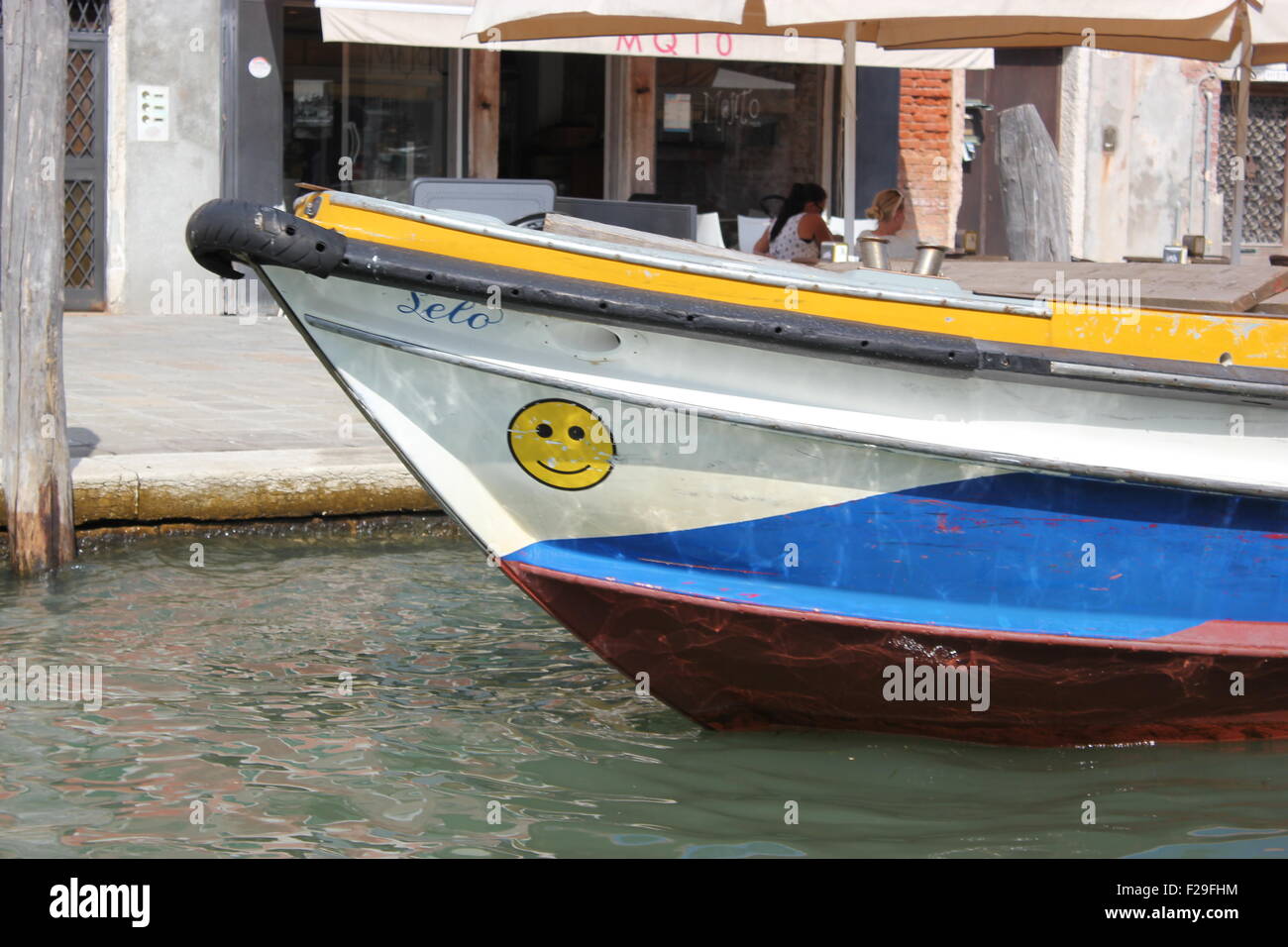 A boat with a smiley face moored in Venice, Italy Stock Photo - Alamy