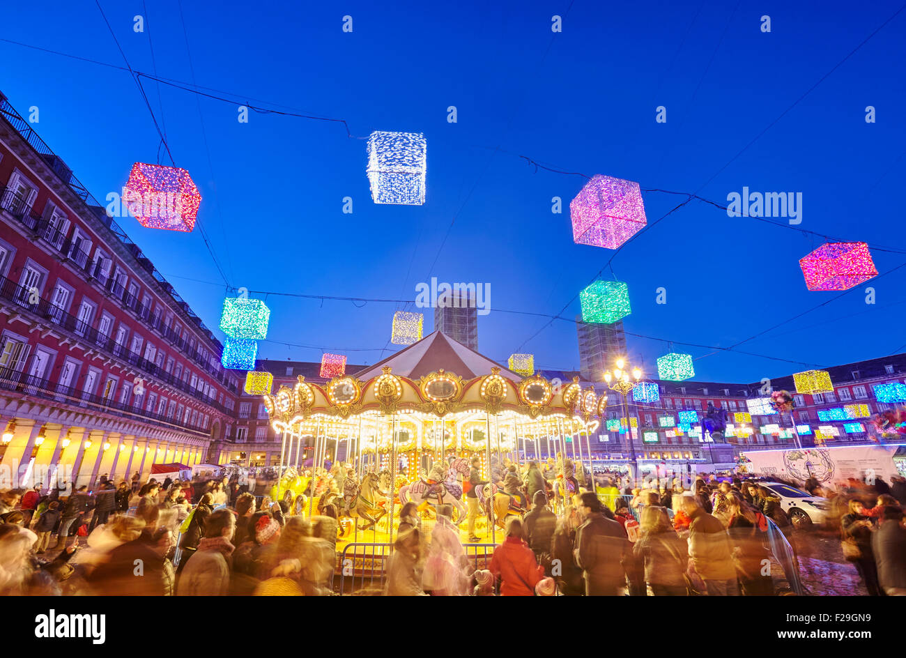 Carousel at Christmas market in Plaza Mayor. Madrid, Spain Stock Photo ...