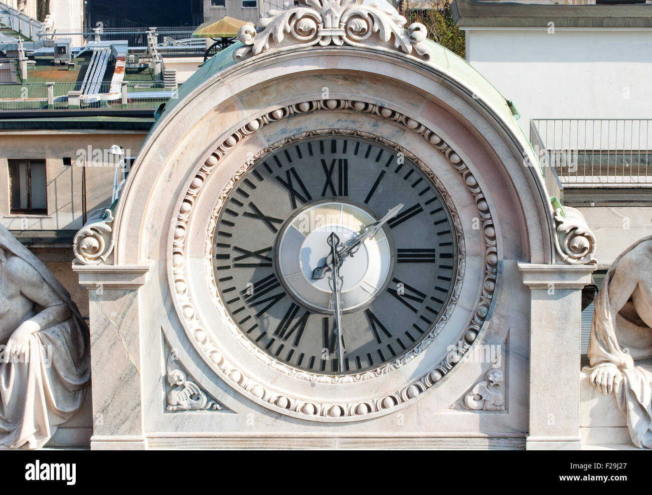 Clock, marble sculpture - Milan Stock Photo - Alamy