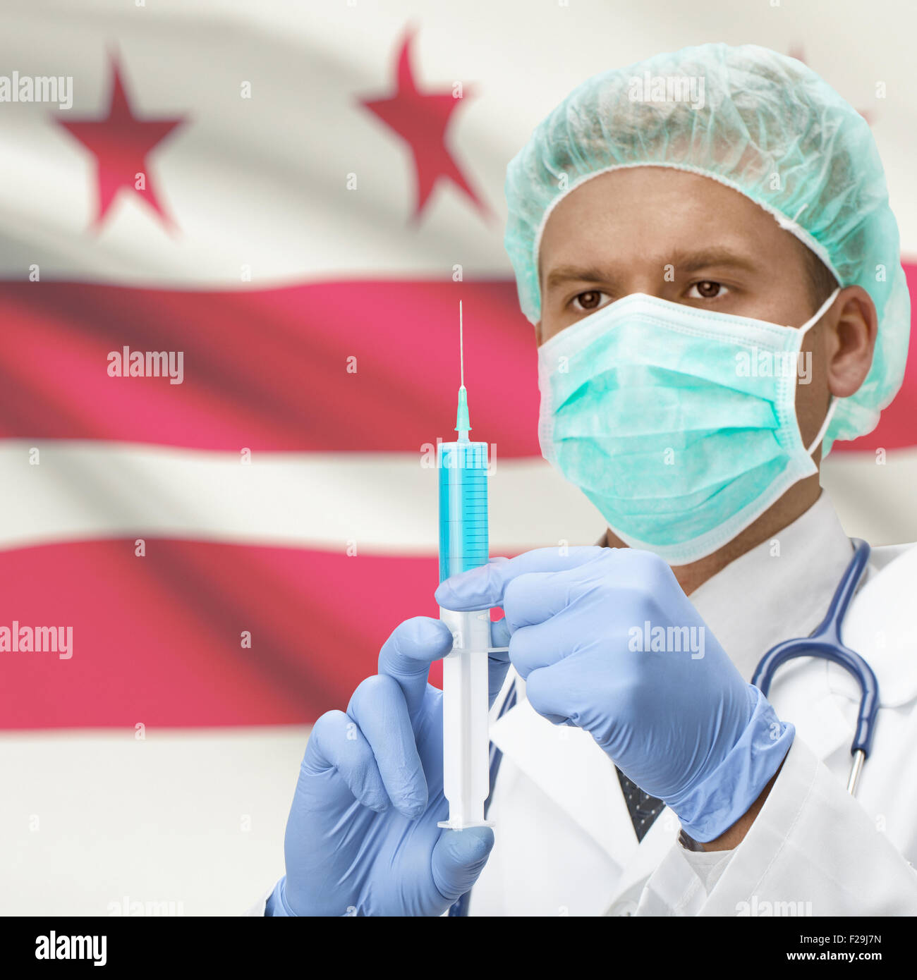 Doctor with syringe in hands and USA states flags on background series ...