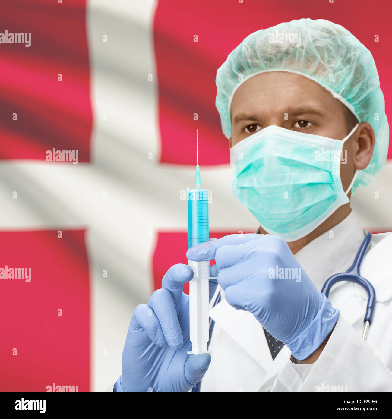 Doctor with syringe in hands and flag on background series - Denmark ...