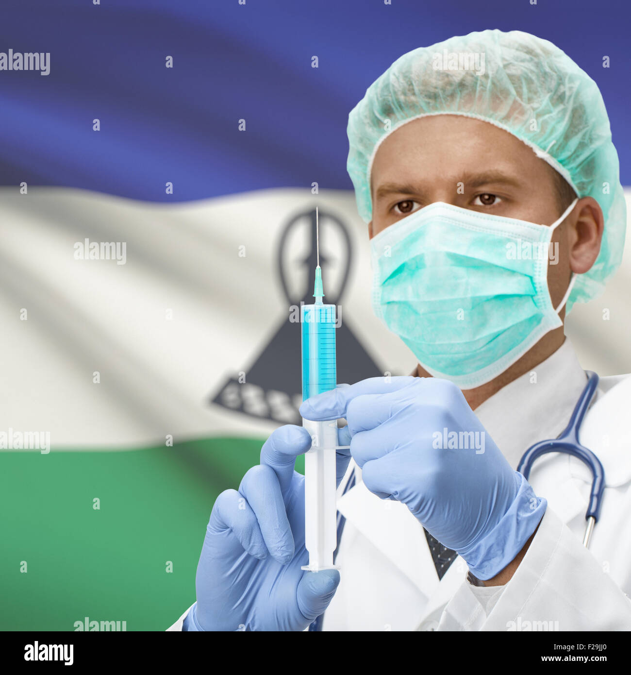 Doctor with syringe in hands and flag on background series - Lesotho ...