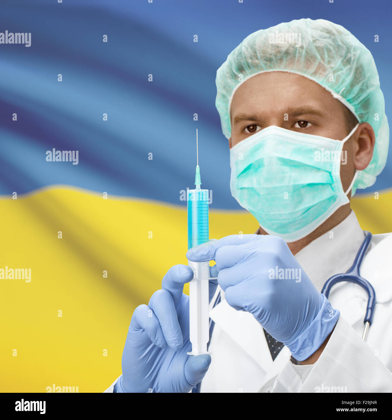 Doctor with syringe in hands and flag on background series - Ukraine ...