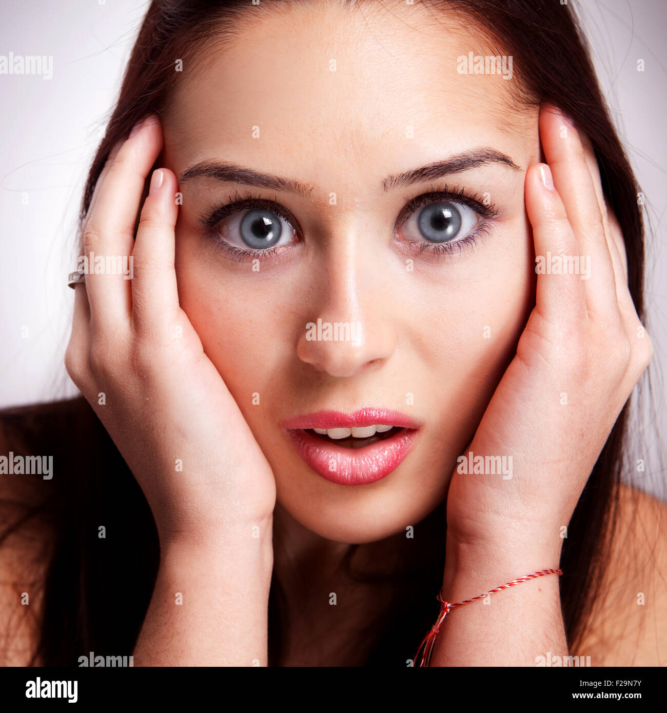 Scared and amazed woman staring at camera Stock Photo - Alamy