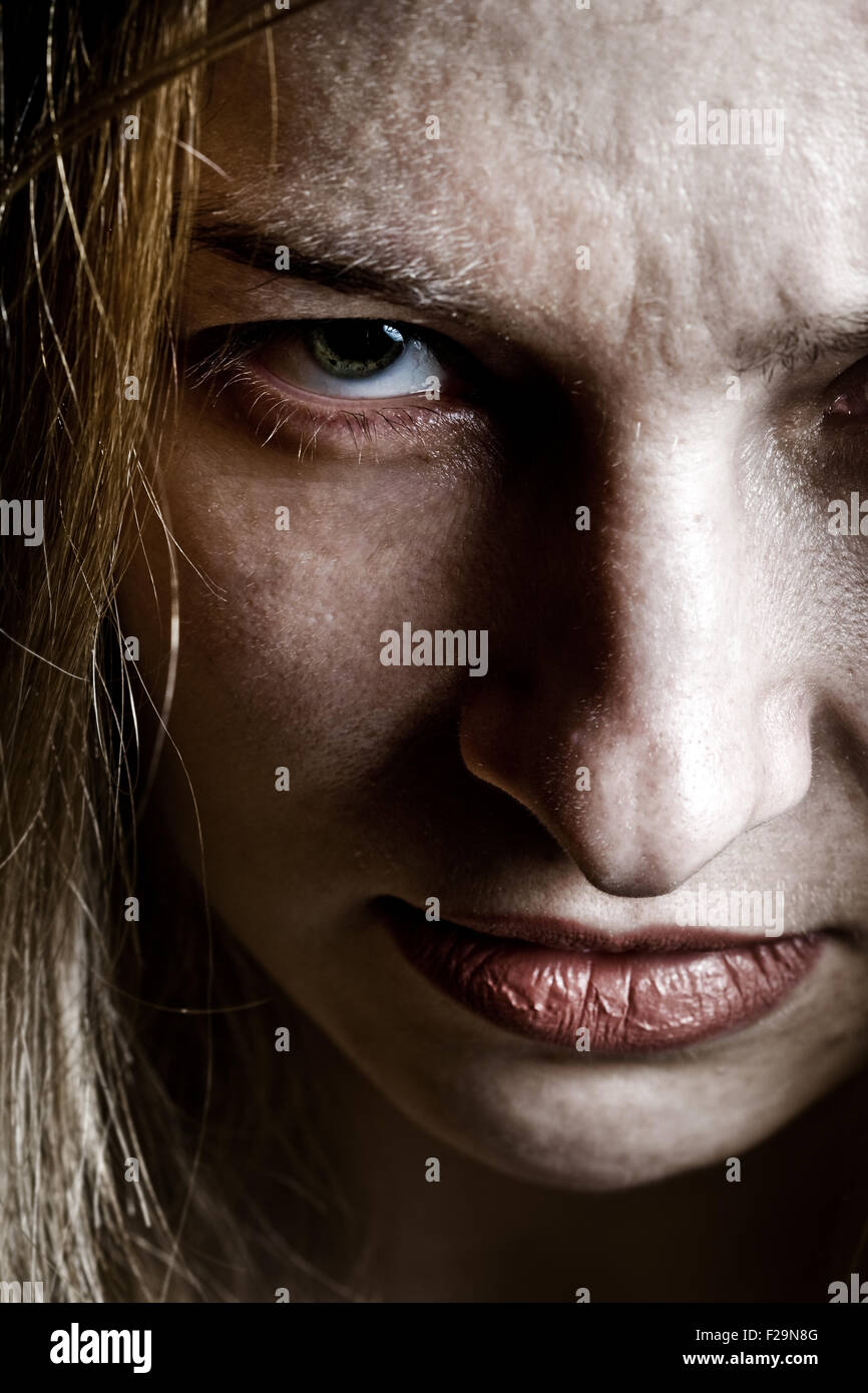 Close up on angry evil upset scary woman Stock Photo - Alamy