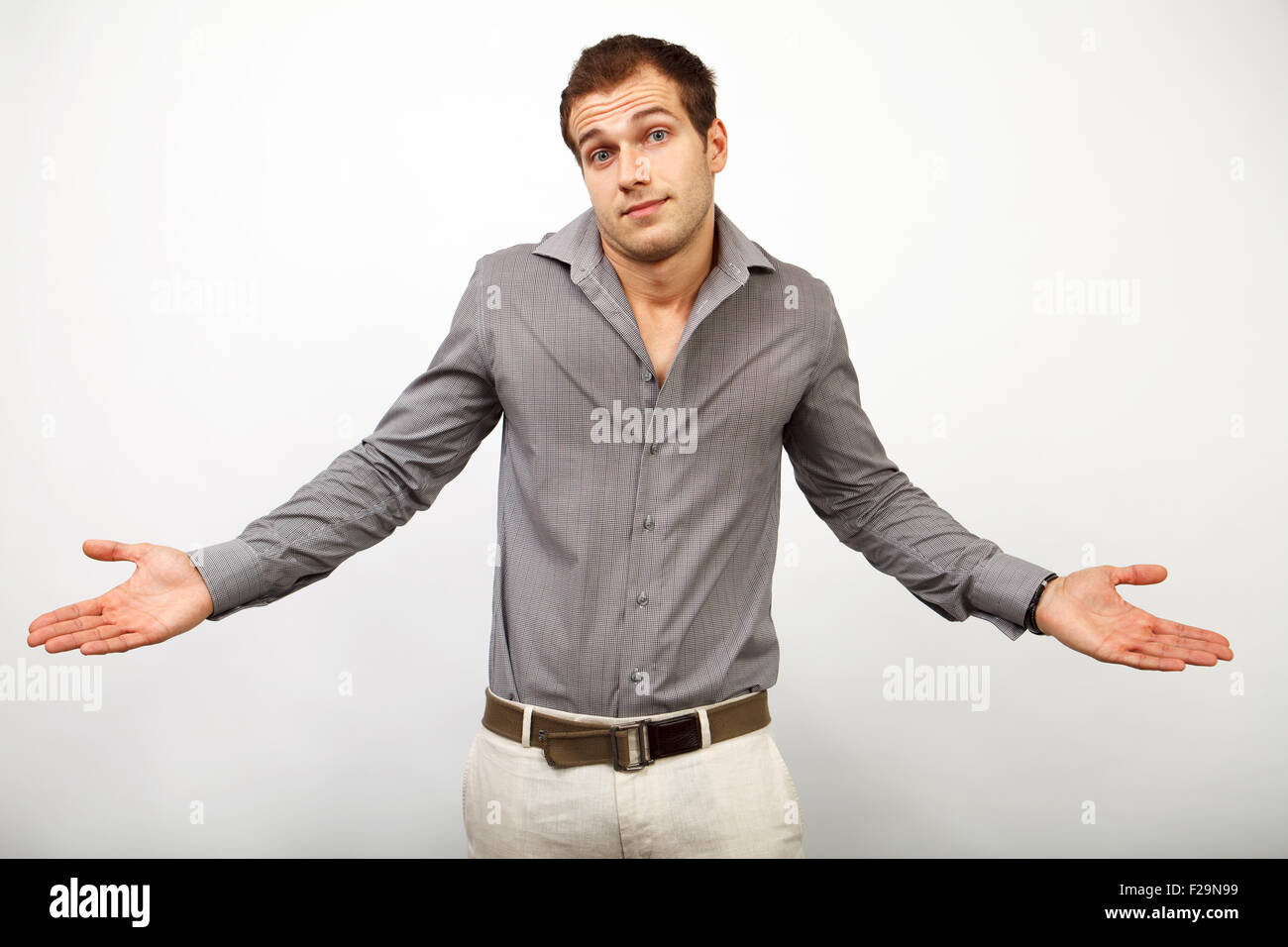 Mistake or sorry concept - confused young man looking innocent Stock ...