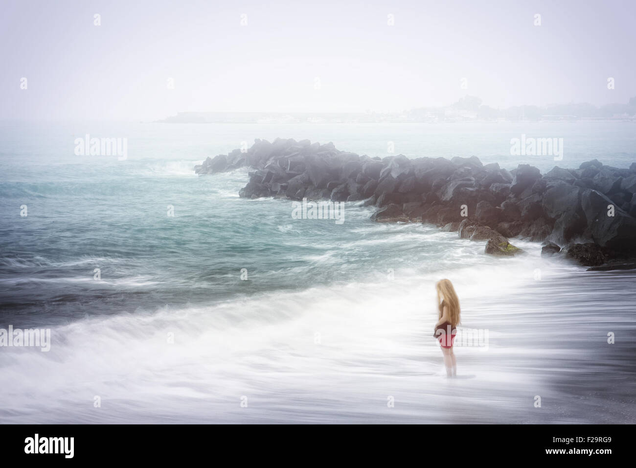 Depression and sadness concept - lonely woman and foggy sea Stock Photo ...