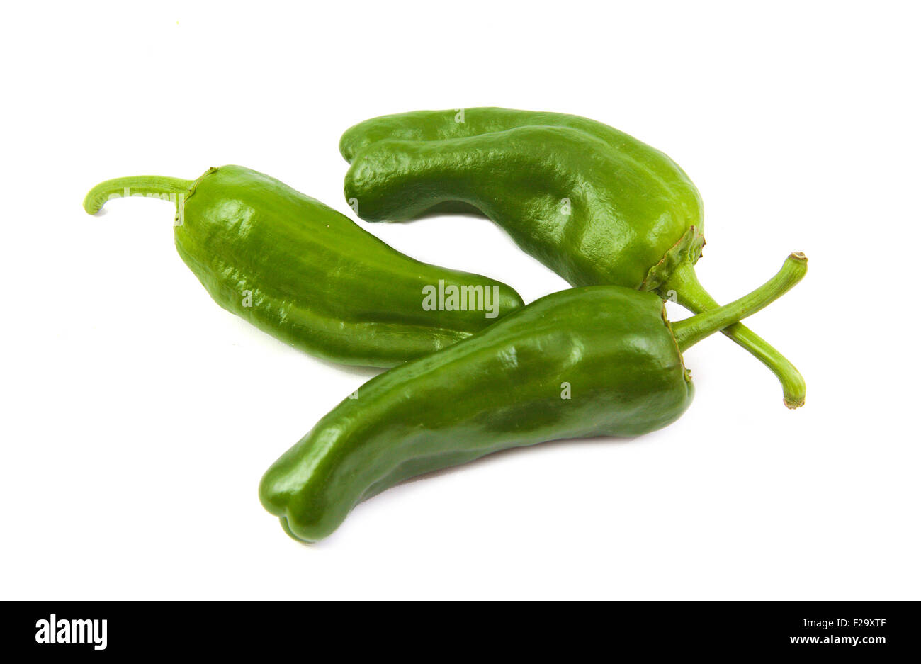 Three green capsicum or sweet pepper on a white background Stock Photo ...