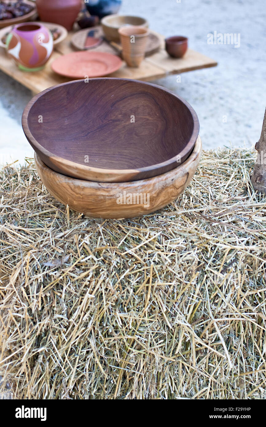 Wooden bowls on bales of hay Stock Photo - Alamy