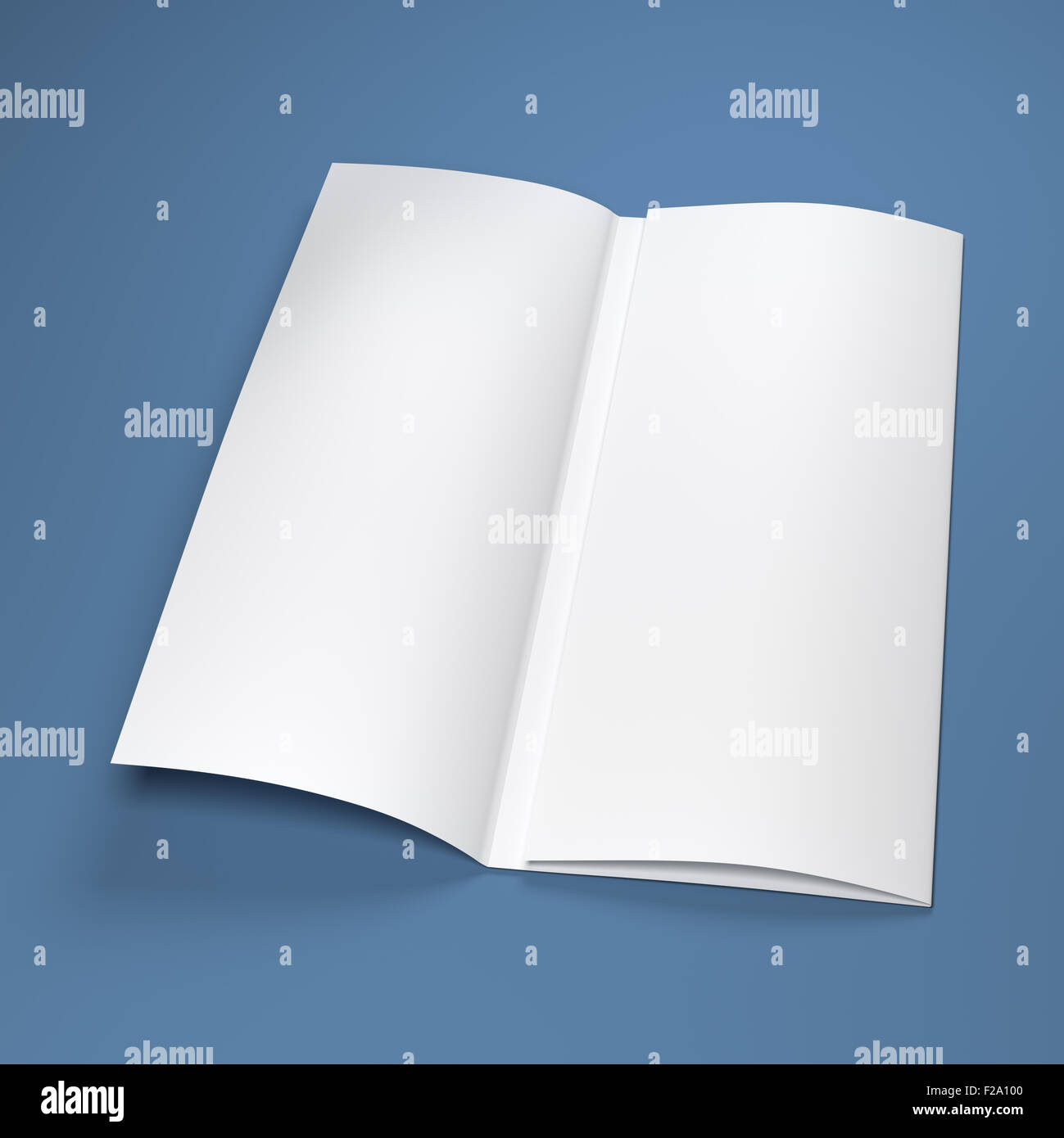 White blank paper brochure on blue background Stock Photo - Alamy