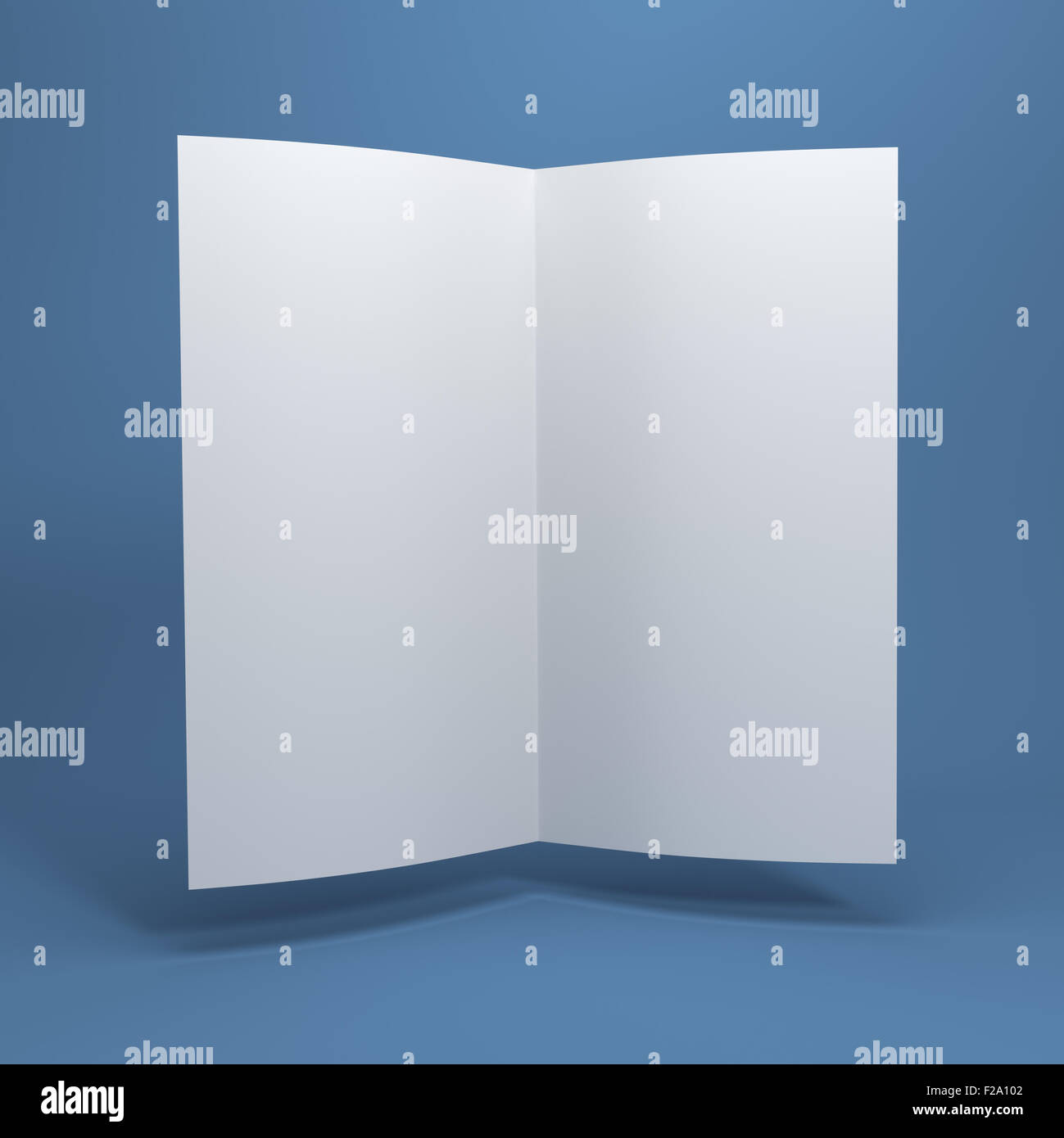 White blank paper brochure on blue background Stock Photo - Alamy