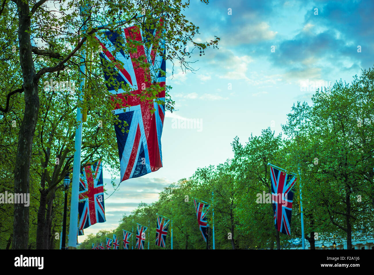 Lines of union jack flags hanging along the Mall, London Stock Photo ...