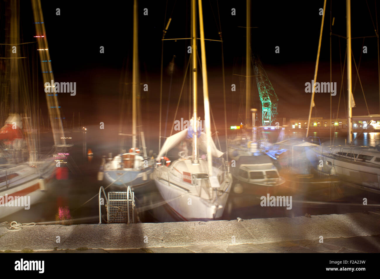 Boat in the pier at night Stock Photo - Alamy