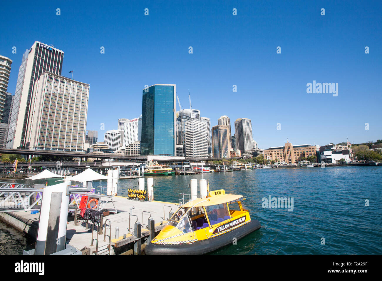 Sydney circular quay with city centre office buildings and water taxi ...