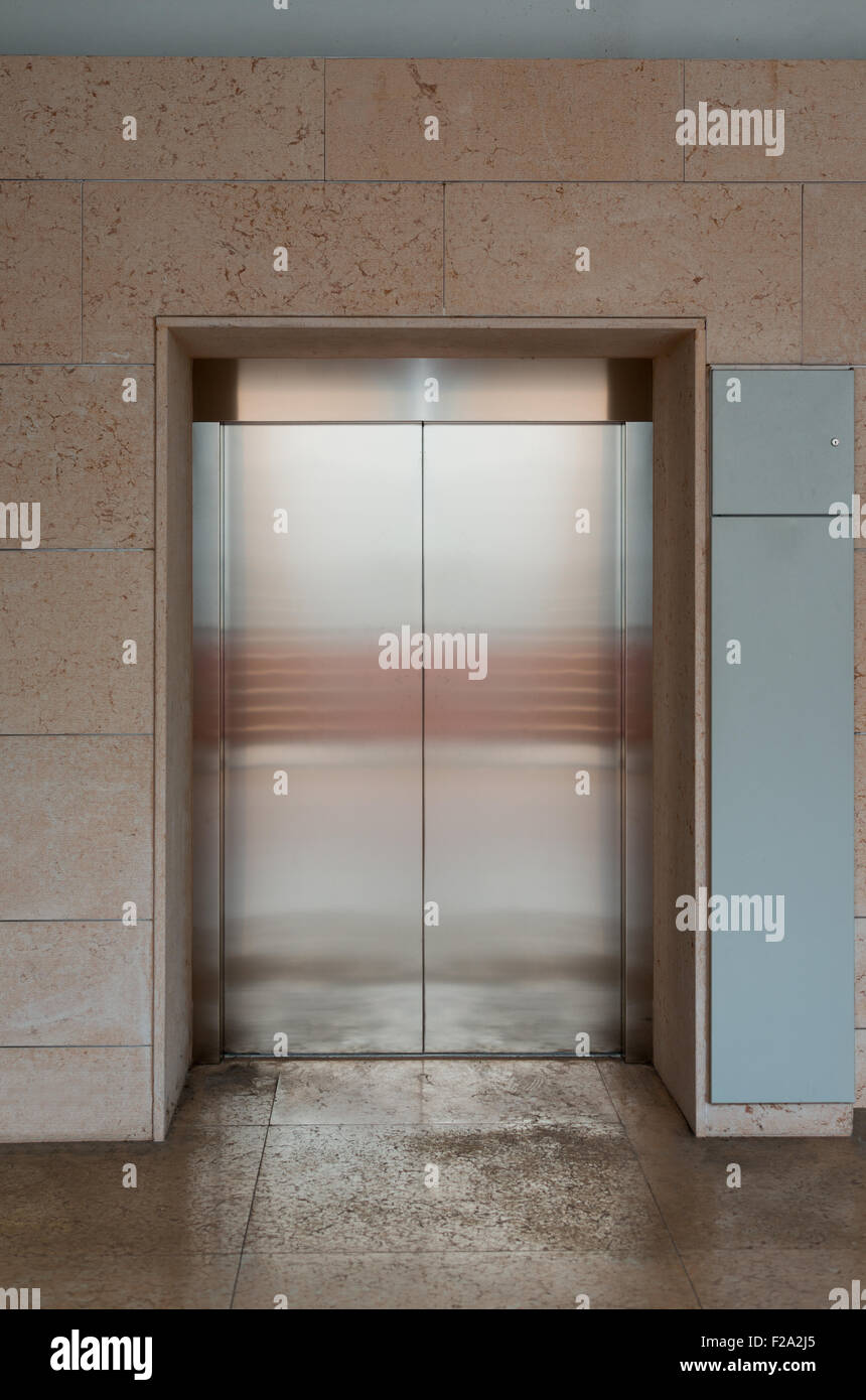 Metal lift inside building Stock Photo - Alamy