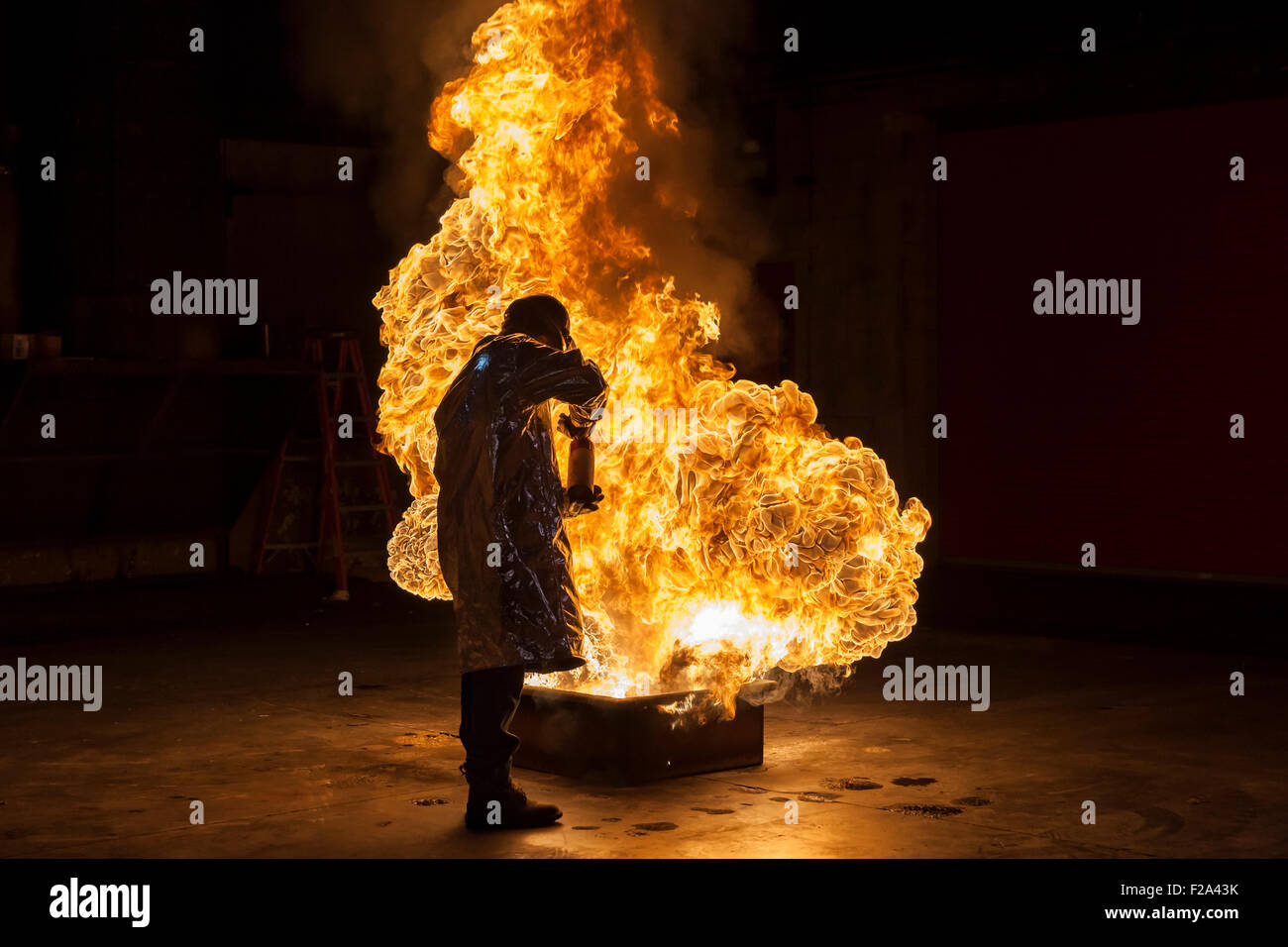 Firefighter extinguishes a heptane 2B-Pan fire with a 2-BTP ...