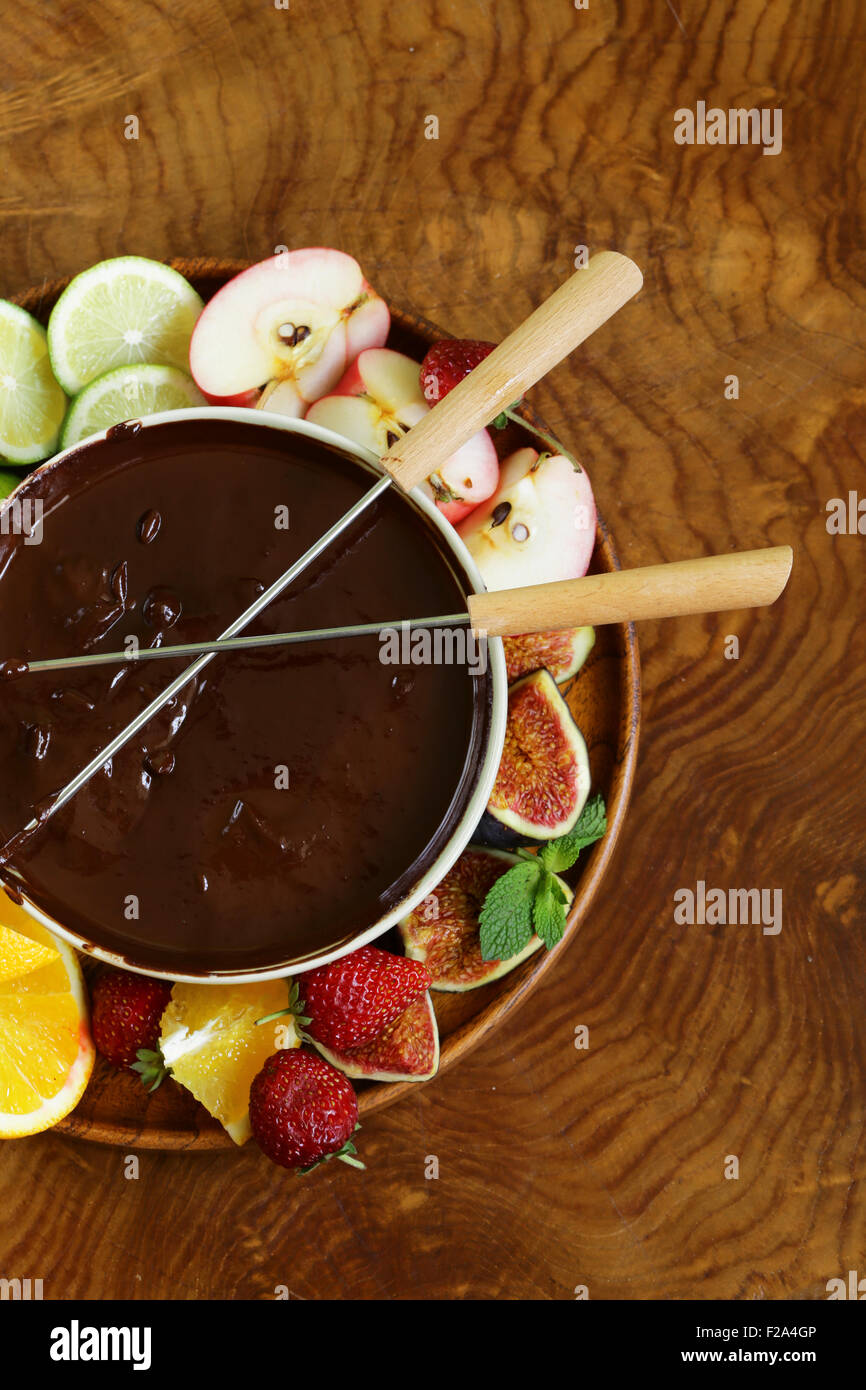 chocolate fondue with various fruits - easy and delicious dessert Stock ...